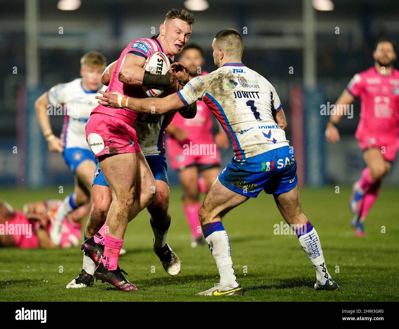Leeds Rhinos' Harry Newman (left) and Wakefield Trinity's Max Jowitt ...