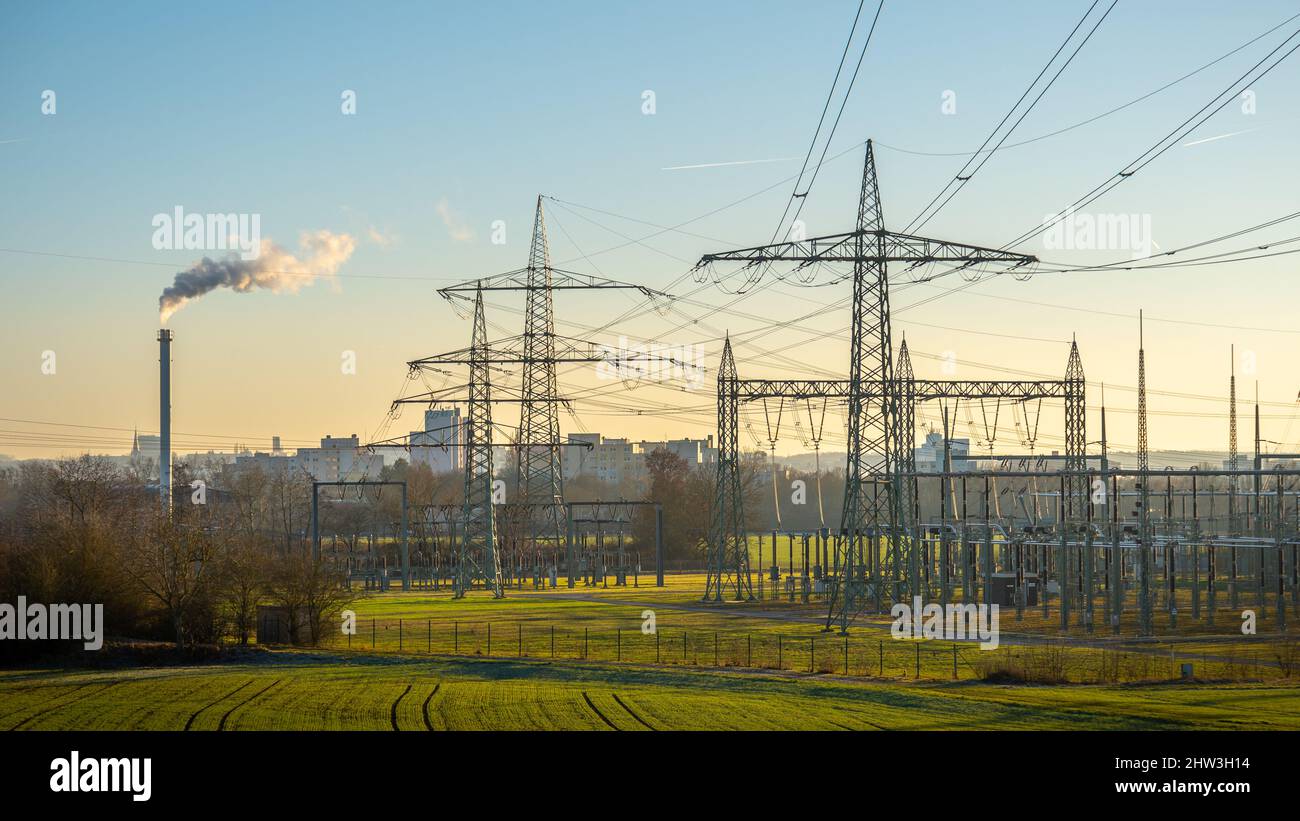Industrial zone with high voltage transmission towers, Germany Stock ...