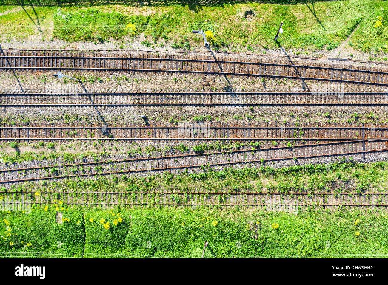 Aerial top view railroad tracks rails and sleepers, several tracks and ...