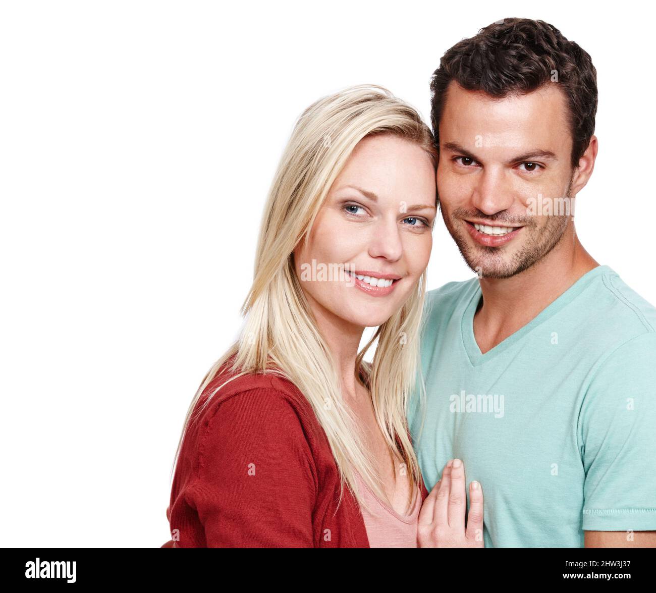 Happy and in love. Portrait of a good looking couple standing together ...