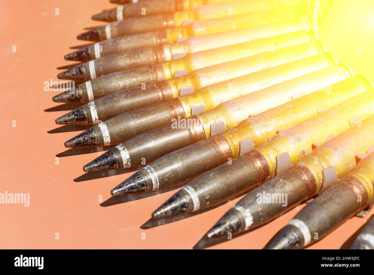 Weapon cartridges ammunitions on stone dark base. Military conflict ...