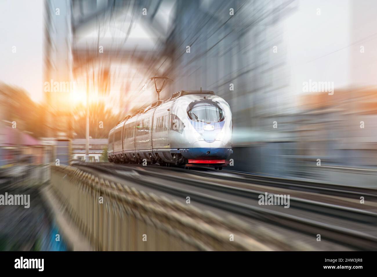 Streamlined train train rides at high speed at the railway bridge Stock ...