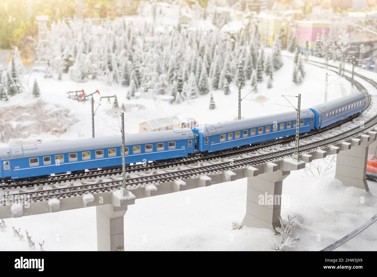 Passenger train, turn on the bridge viaduct Stock Photo - Alamy