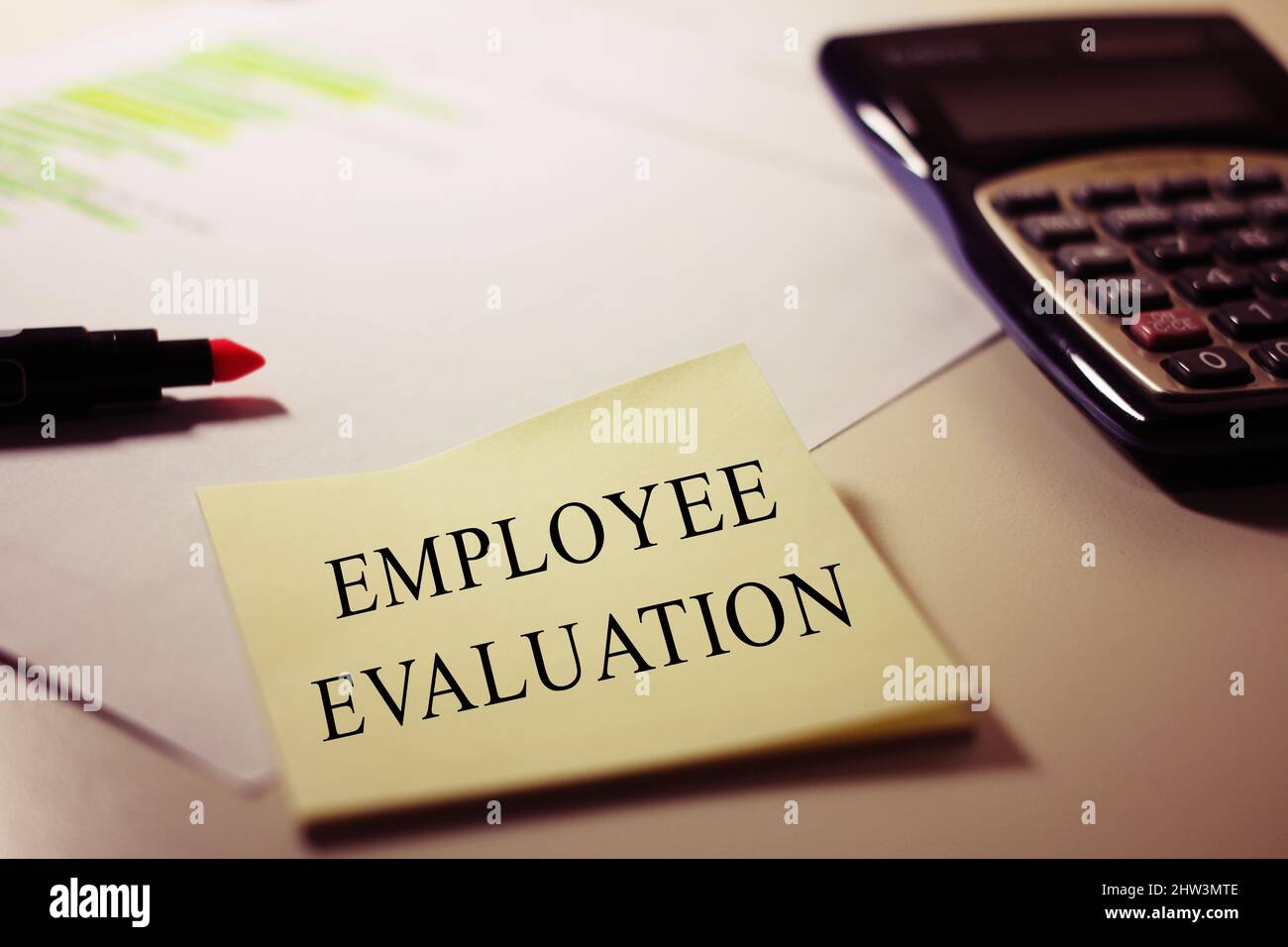 Office background with the word "Employee evaluation Stock Photo - Alamy