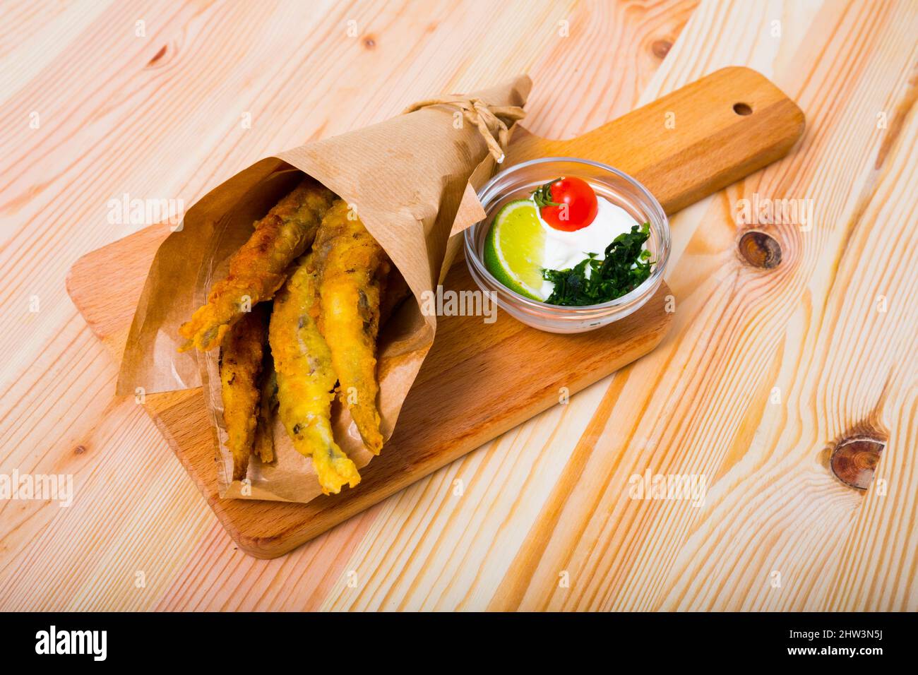 Fish and chips with creamy cheese sauce Stock Photo - Alamy