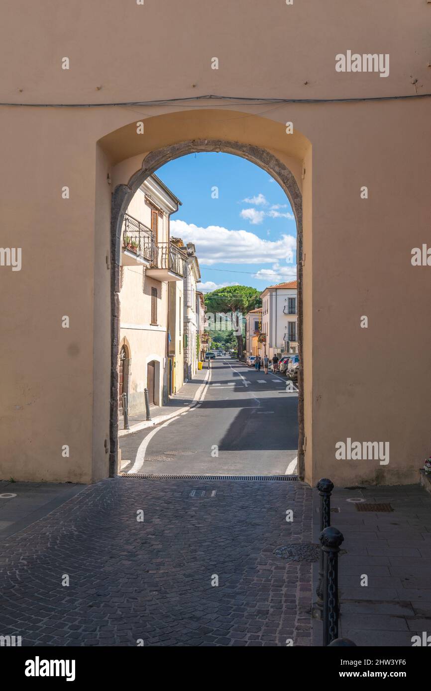 Empty street in Onano through an old arch in the wall, Italy Stock ...