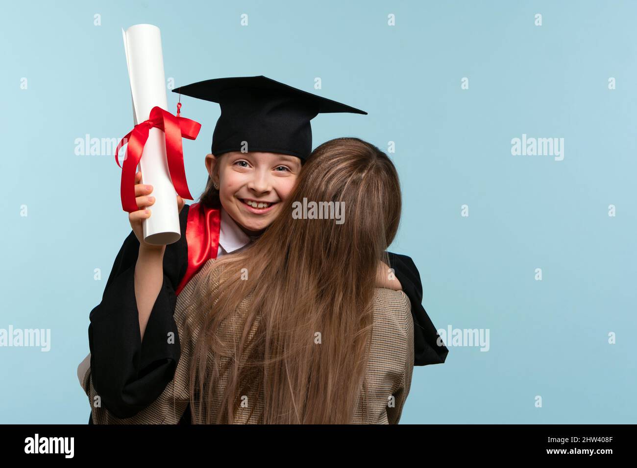 Little girl graduate celebrating graduation. Child wearing graduation ...