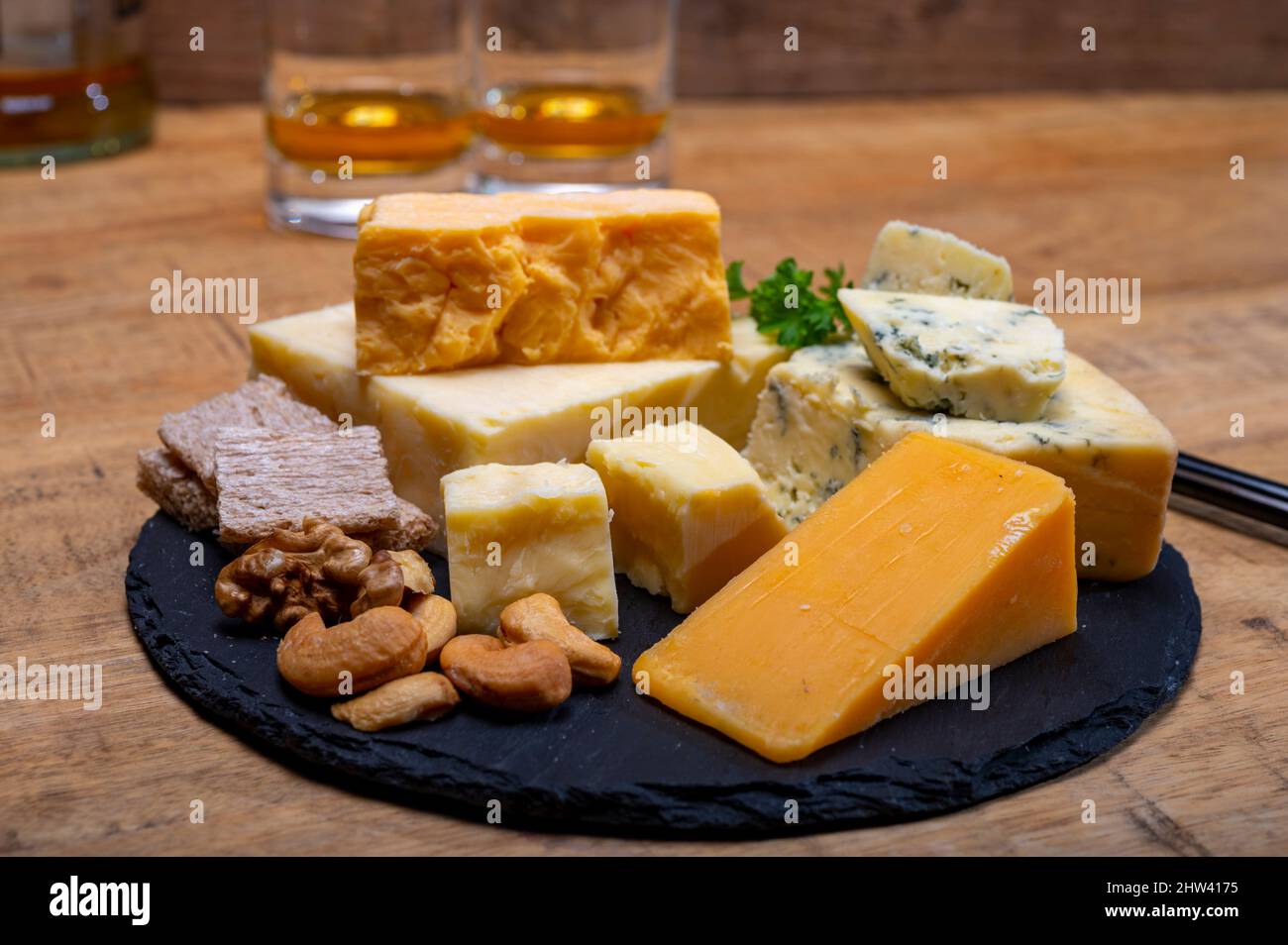 British drinks and food pairing, glasses of Scotch whisky and cheeses ...