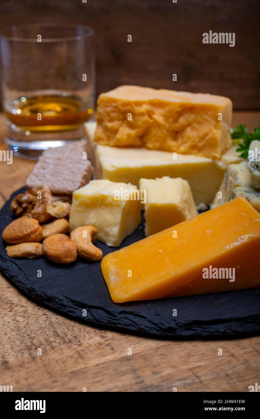 British drinks and food pairing, glasses of Scotch whisky and cheeses ...