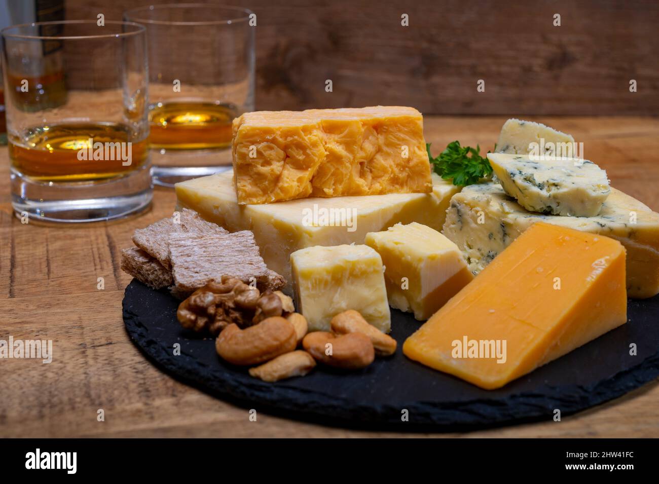 British drinks and food pairing, glasses of Scotch whisky and cheeses ...