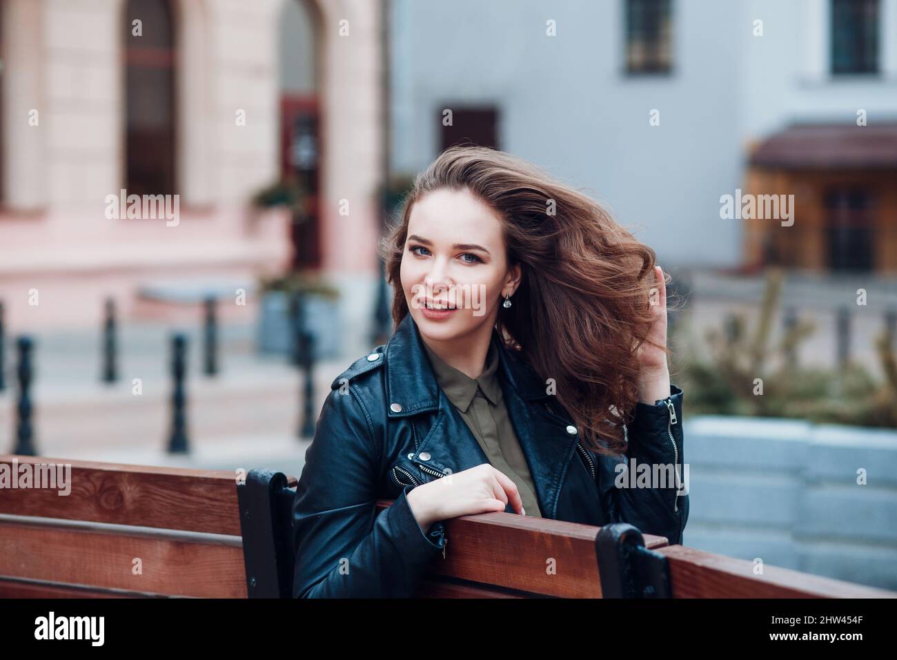Beautiful woman looking back over her shoulder Stock Photo - Alamy