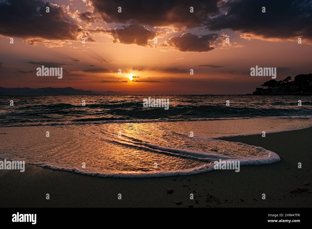 Beautiful sunset at the beach Stock Photo - Alamy