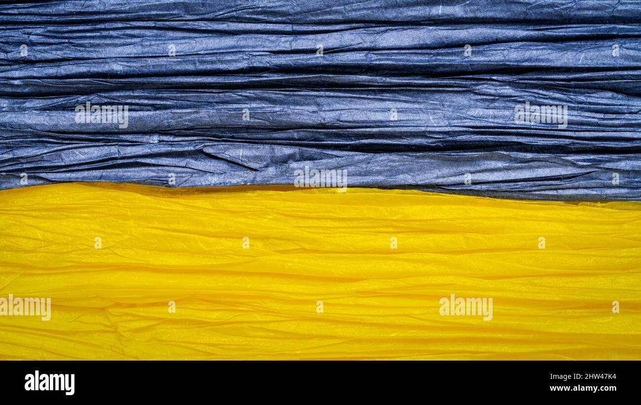 paper abstract in colors of Ukrainian national flag - blue and yellow ...