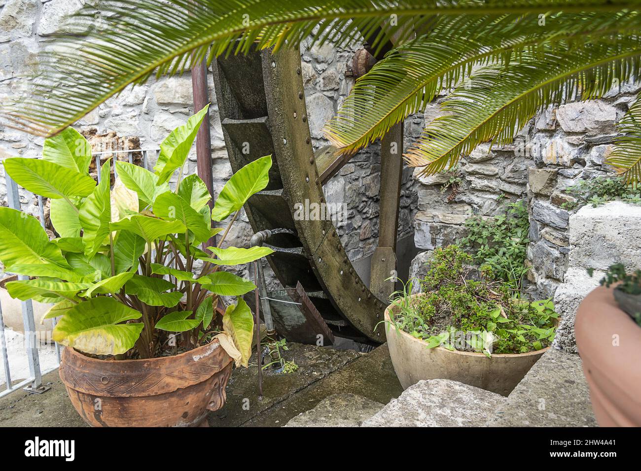 View of a wooden wheel from an ancien water mill, in the village of ...