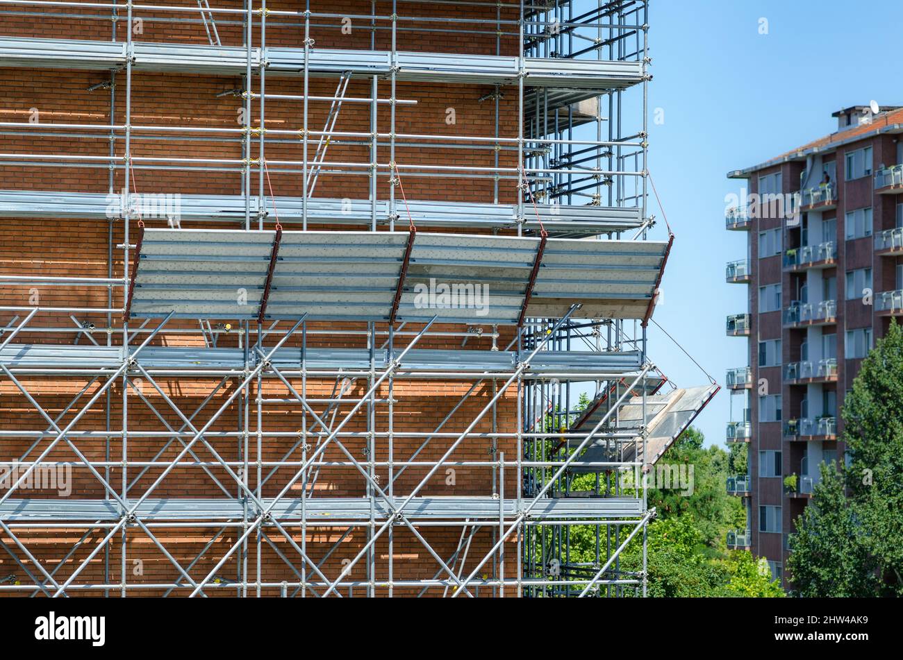Construction: scaffolding with steel supporting structure on the facade ...