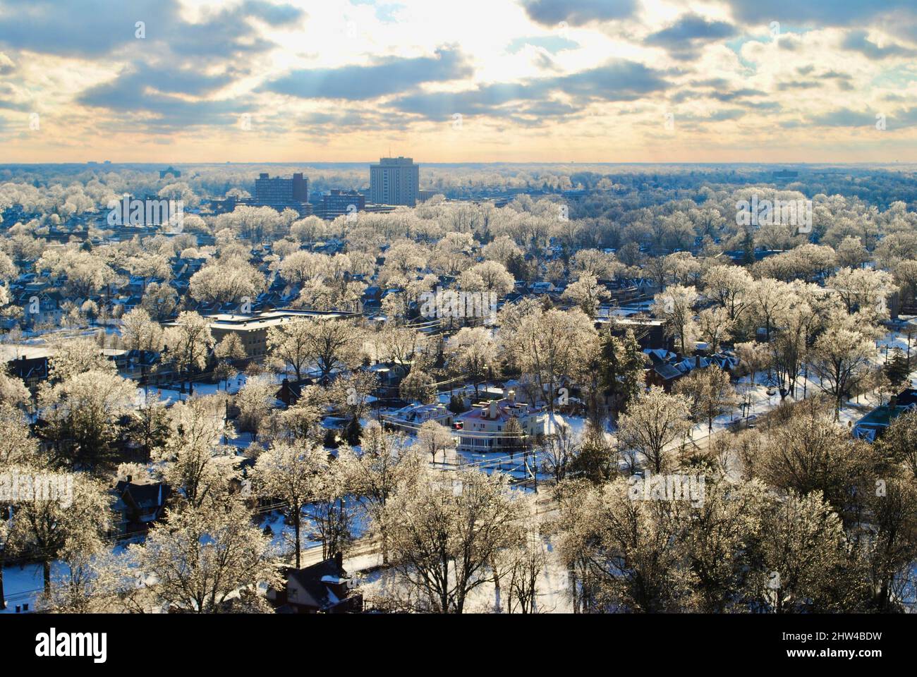 Ice covered trees and houses after ice storm and freezing rain in ...