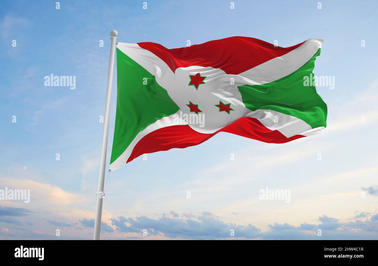 official flag of Burundi at cloudy sky background on sunset, panoramic ...