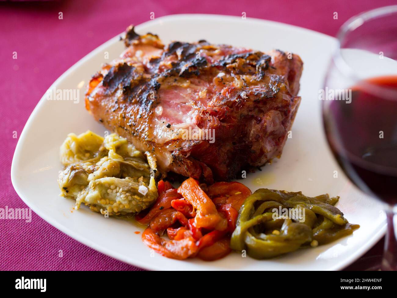 Grilled pork knuckle with vegetables Stock Photo - Alamy