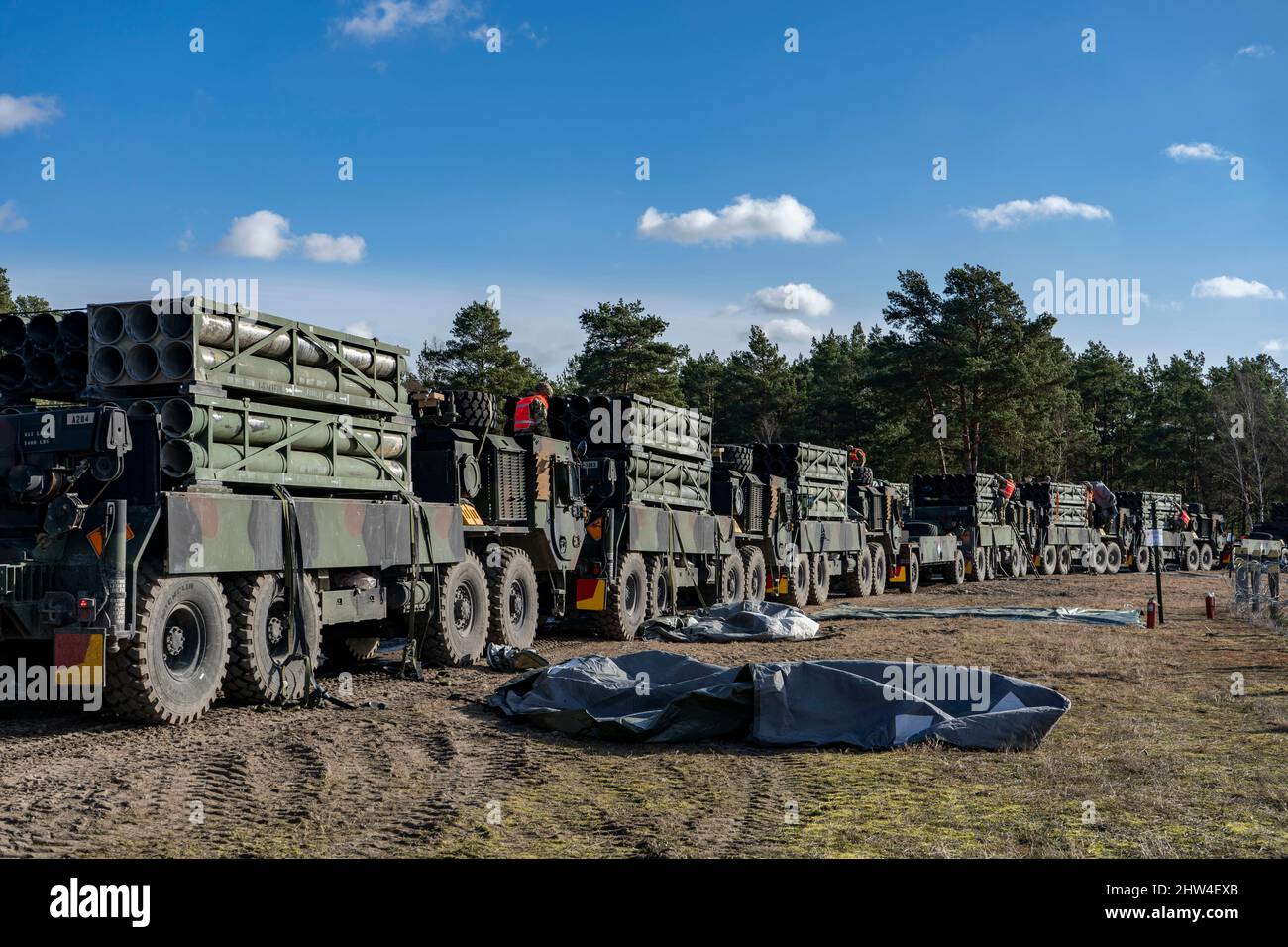 U.S. Soldiers assigned to 41st Field Artillery Brigade, untie empty ...