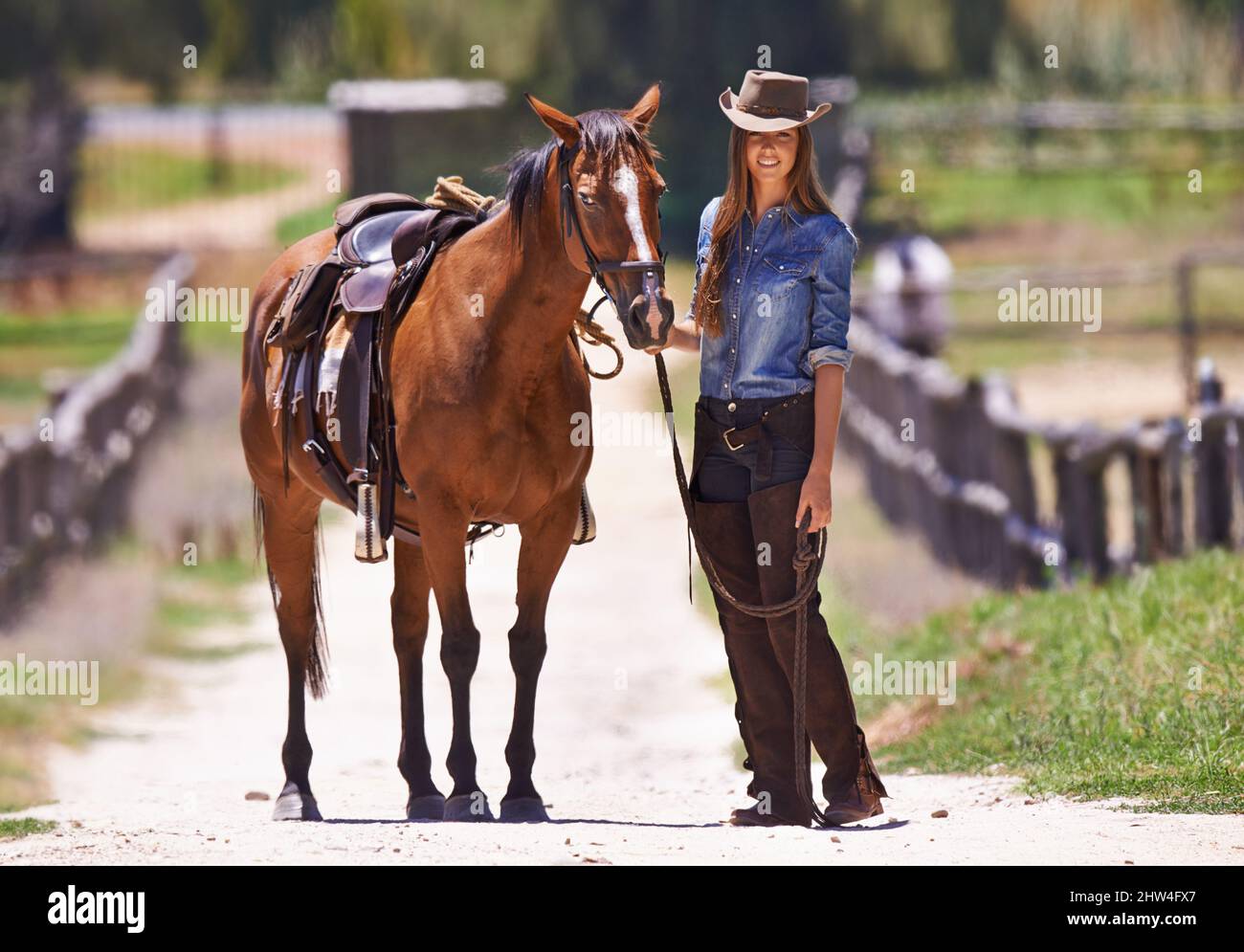 Shes going to be a champion someday. Shot of a cow girl leading her ...