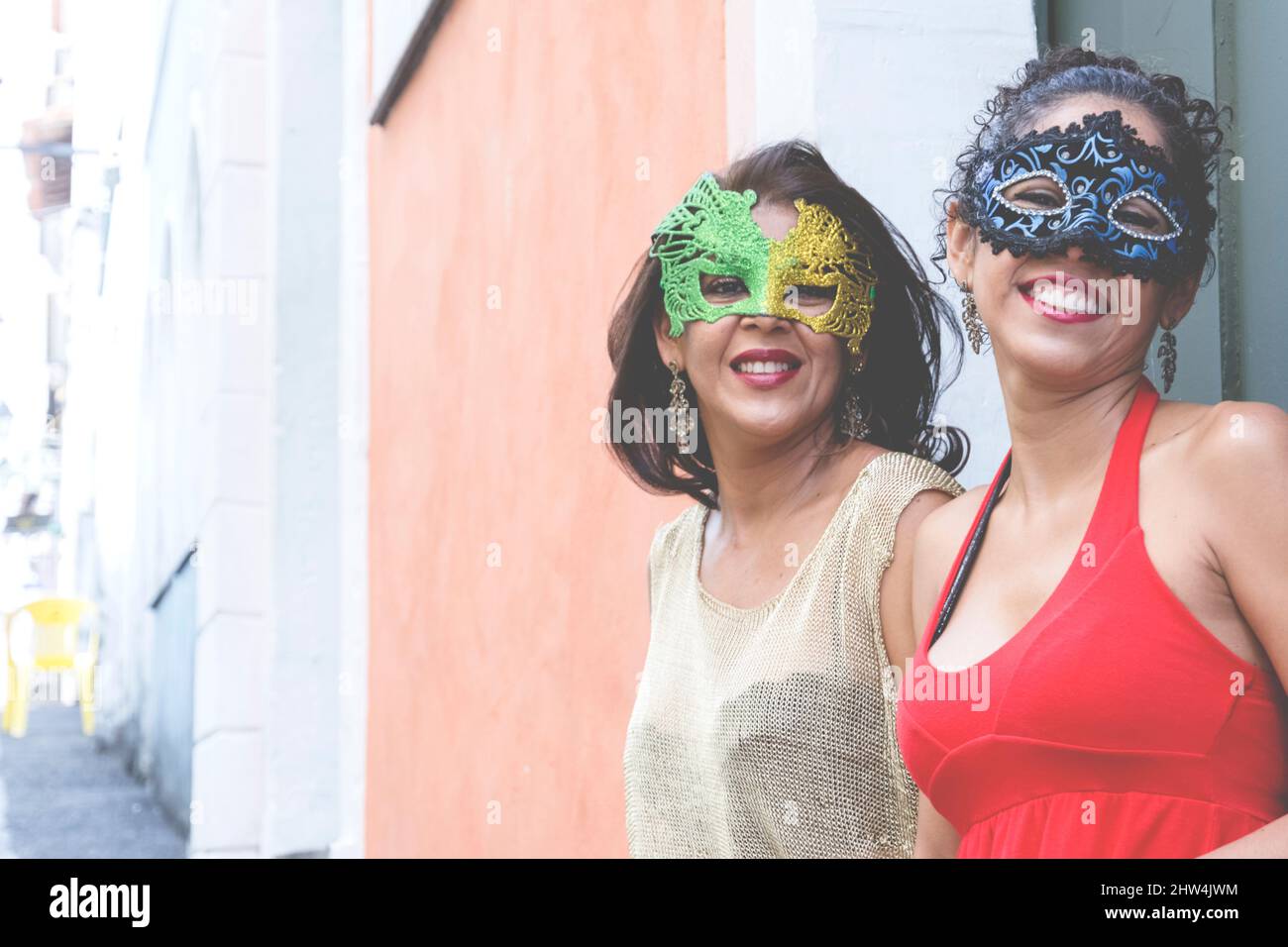 Portrait of two women wearing Venice Carnival mask. Salvador, Bahia ...