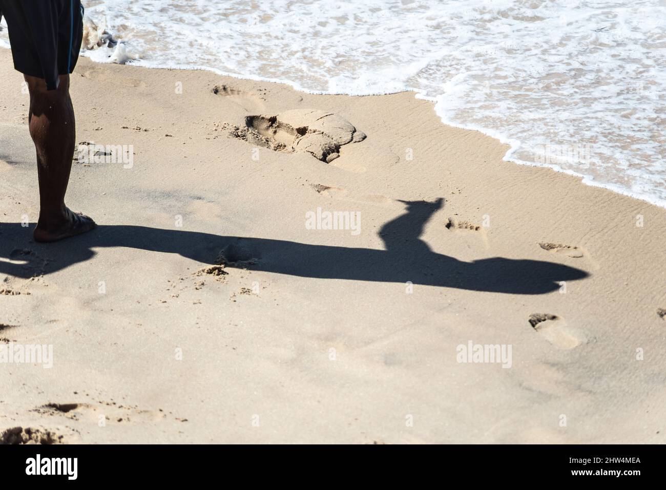Human shadows on a beach hi-res stock photography and images - Alamy