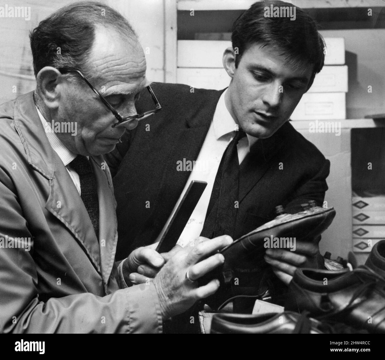 Chelsea forward Bobby Tambling watches as his boots are specially made ...