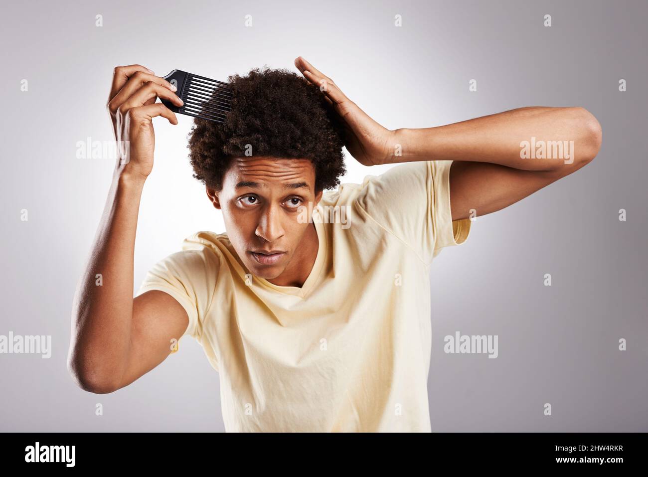 African american combing afro hi-res stock photography and images - Alamy