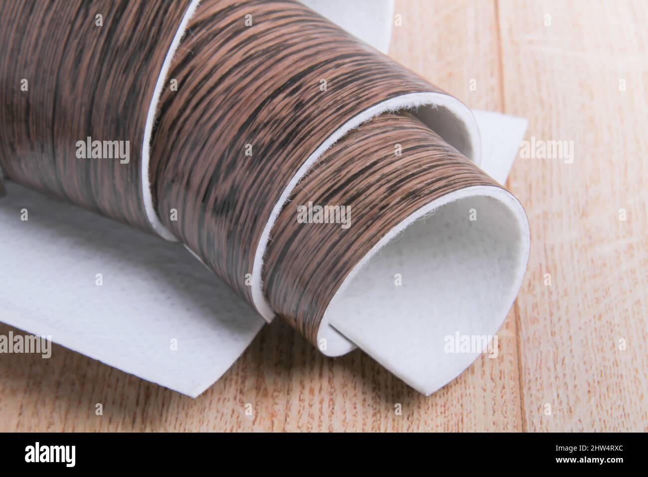 Linoleum. Roll of linoleum on a black background. Floor coverings ...