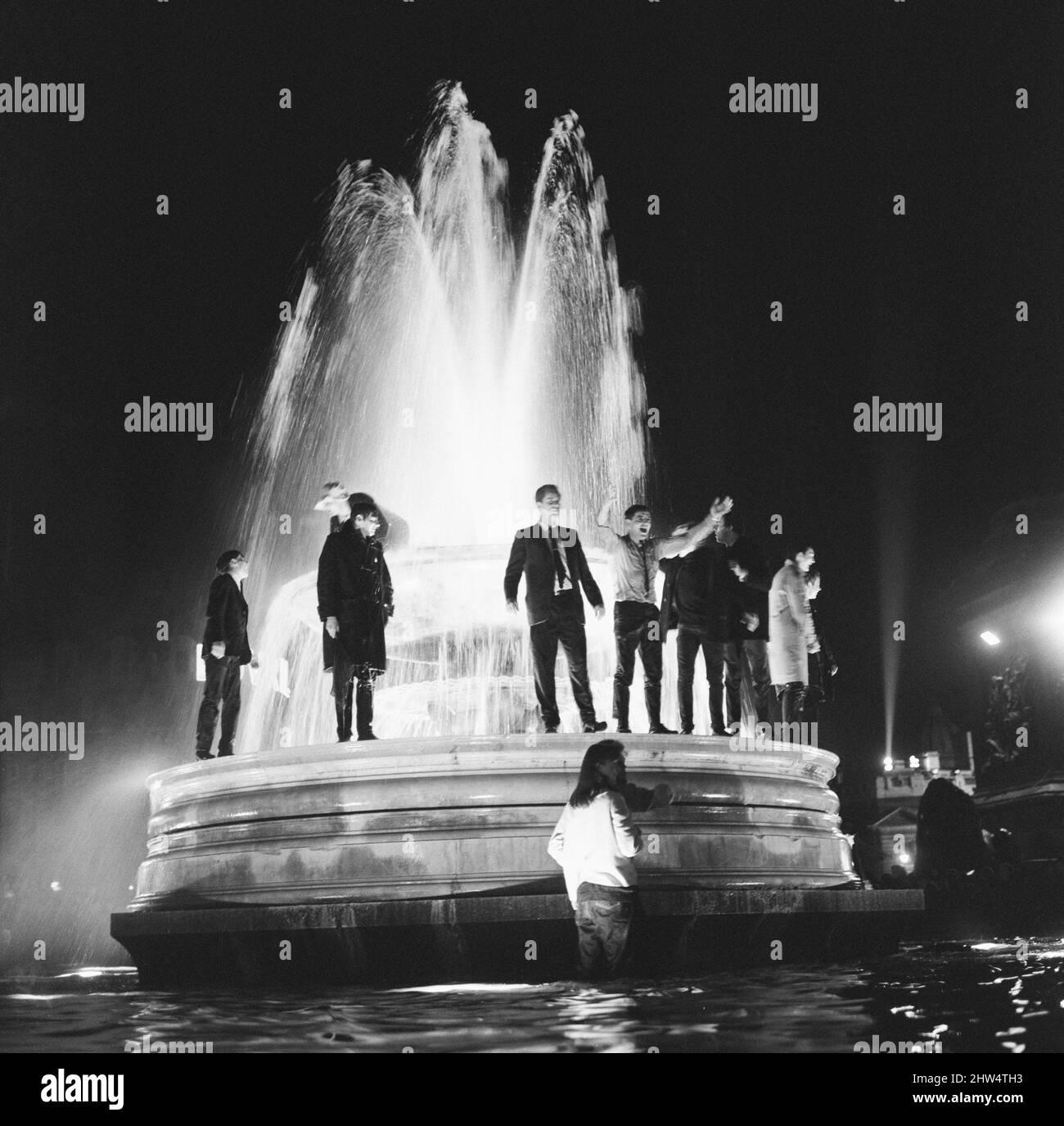 New Years Day 1967. Young people celebrate in the fountains at ...