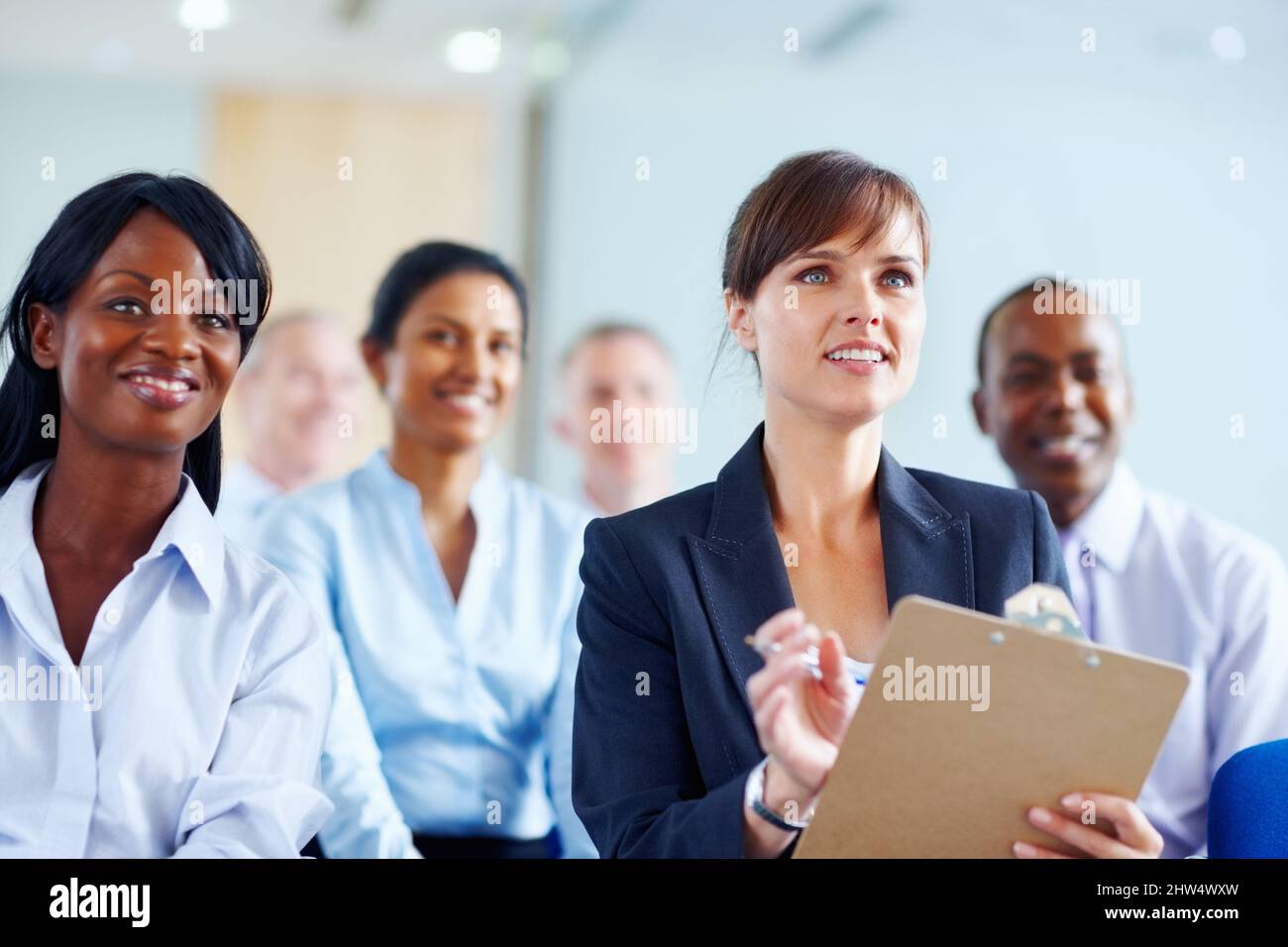Female executive with colleagues. Focus on female executive with ...