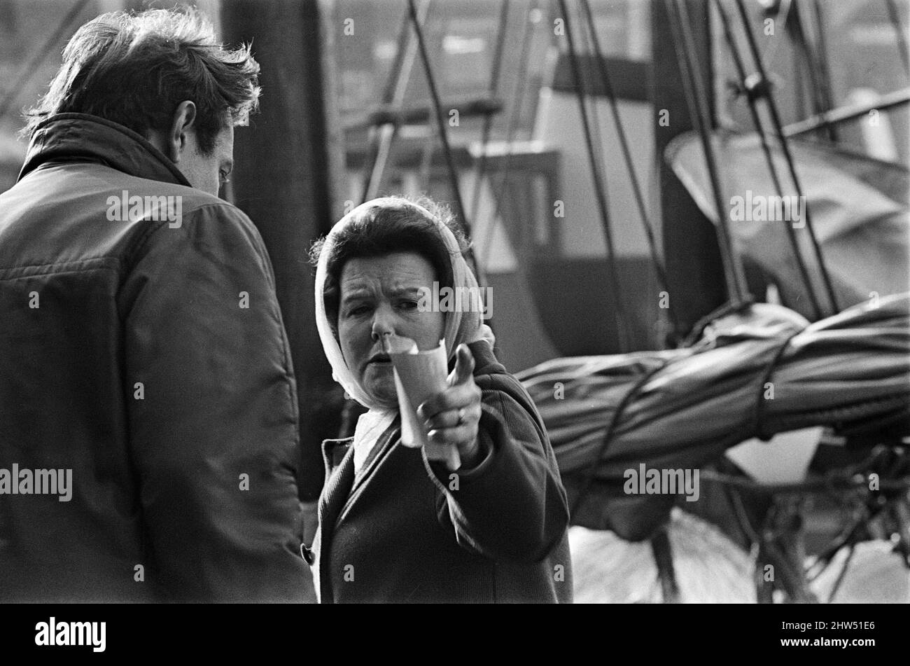 A relative waits at the fish dock for any news. The fishing industry in ...