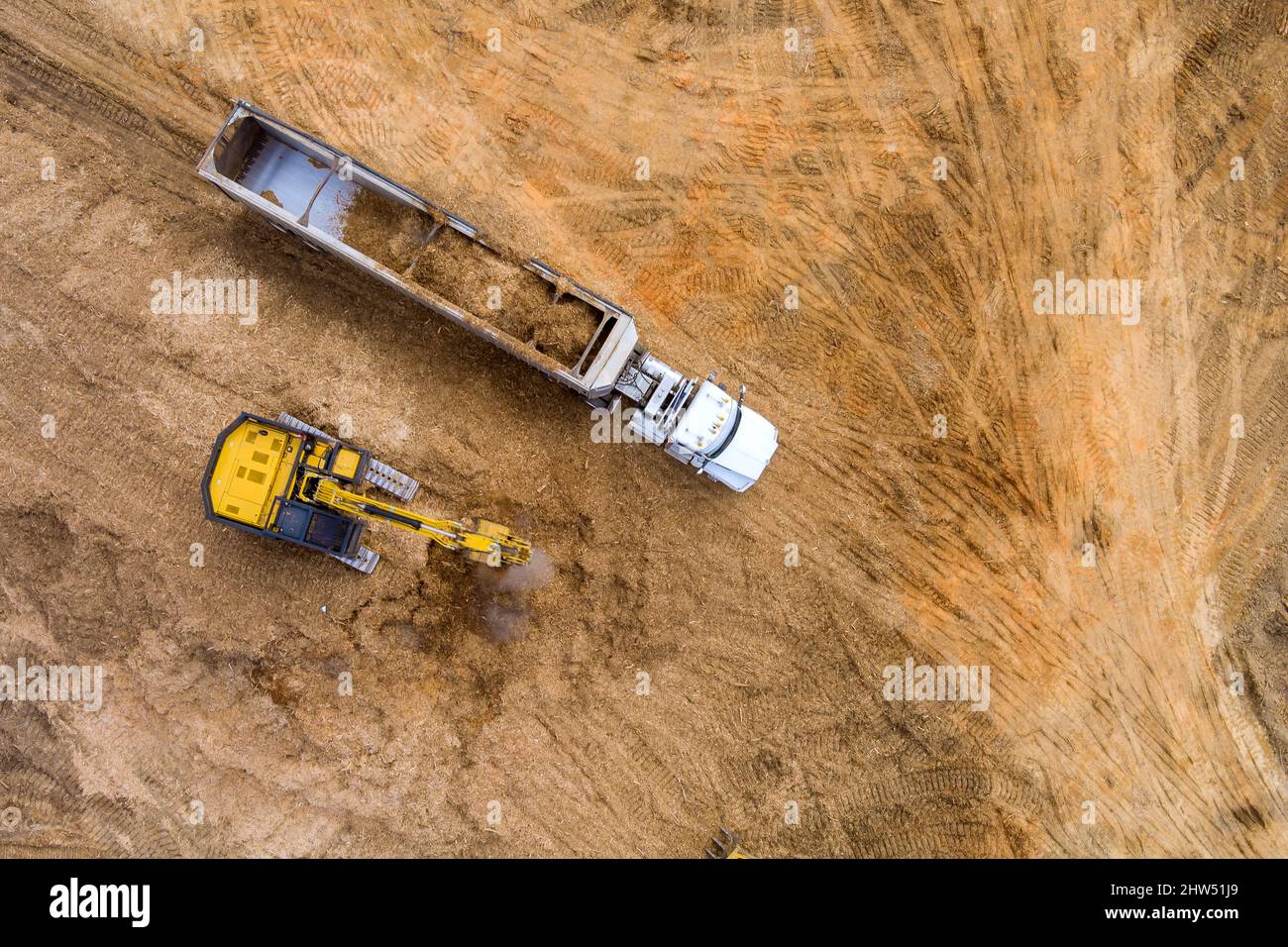 Aerial view on Crawler excavator in the process of work digs up the ...