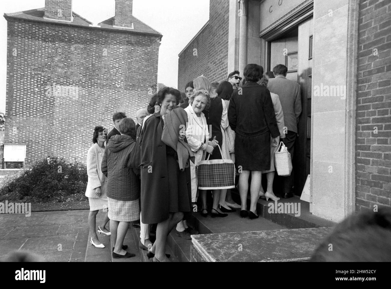 Members of the public waiting to go into court to see Mick Jagger and ...