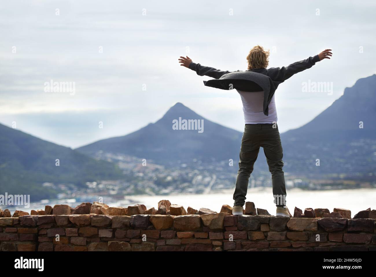 Man standing on a sea wall hi-res stock photography and images - Alamy
