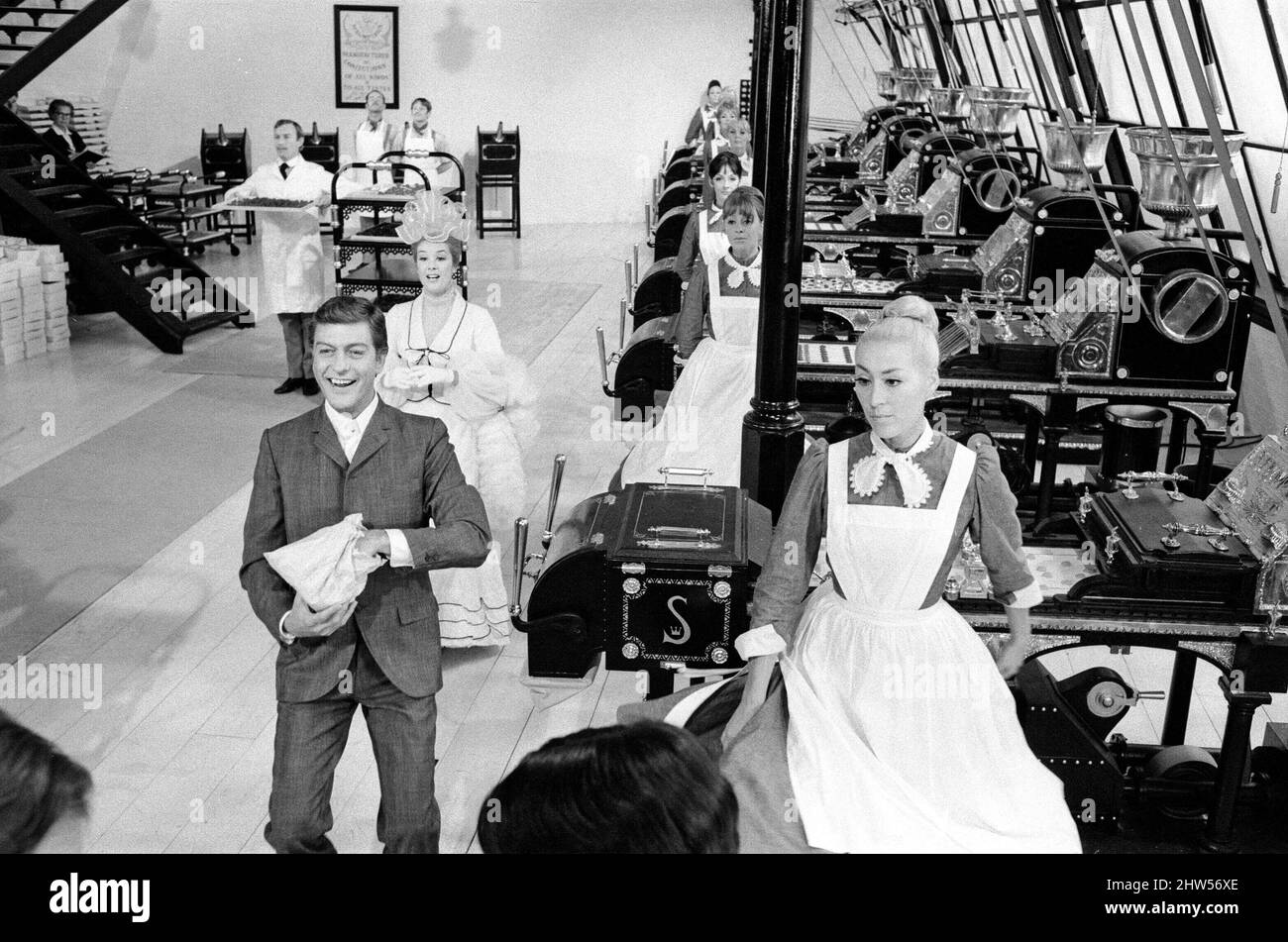 Dick Van Dyke and Sally Ann Howes (behind) filming a scene for Chitty ...