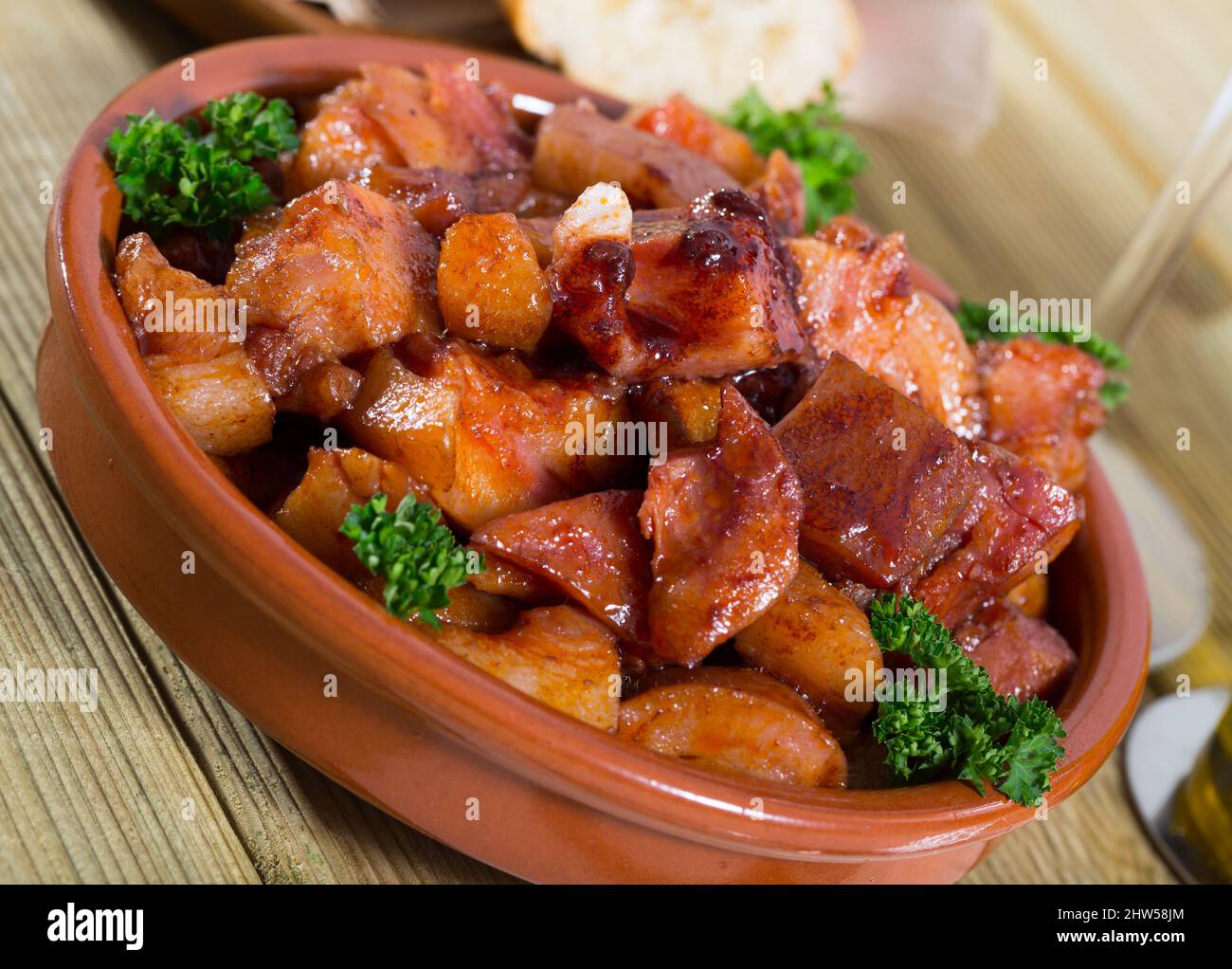 Morro de cerdo - spanish dish. Roast nose and cheek pigs with parsley ...