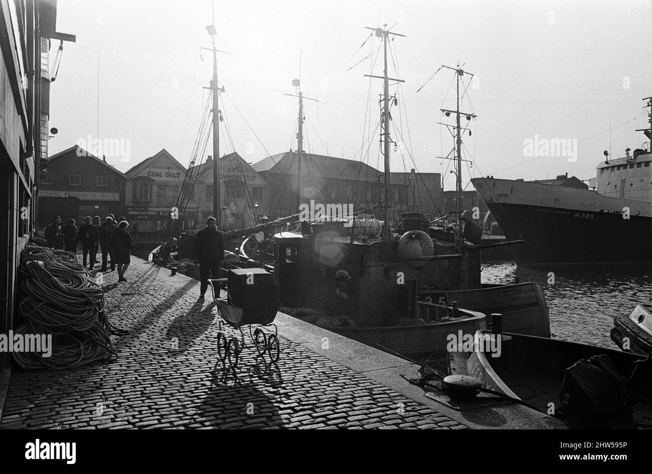 View of the fish dock with empty pram in foreground left by wife and ...