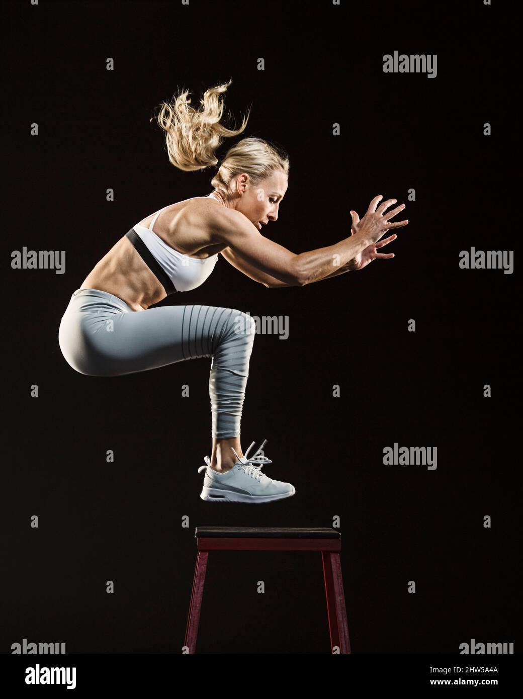 Woman jumping over hi-res stock photography and images - Alamy