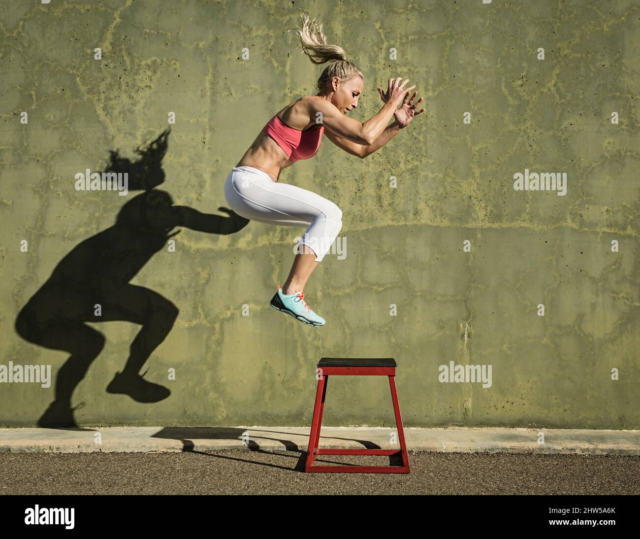 Woman jumping over hi-res stock photography and images - Alamy
