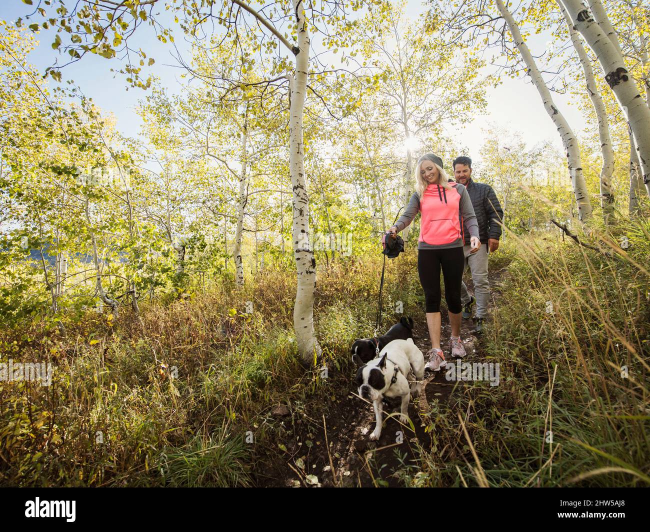 Walking dogs women smiling hi-res stock photography and images - Alamy