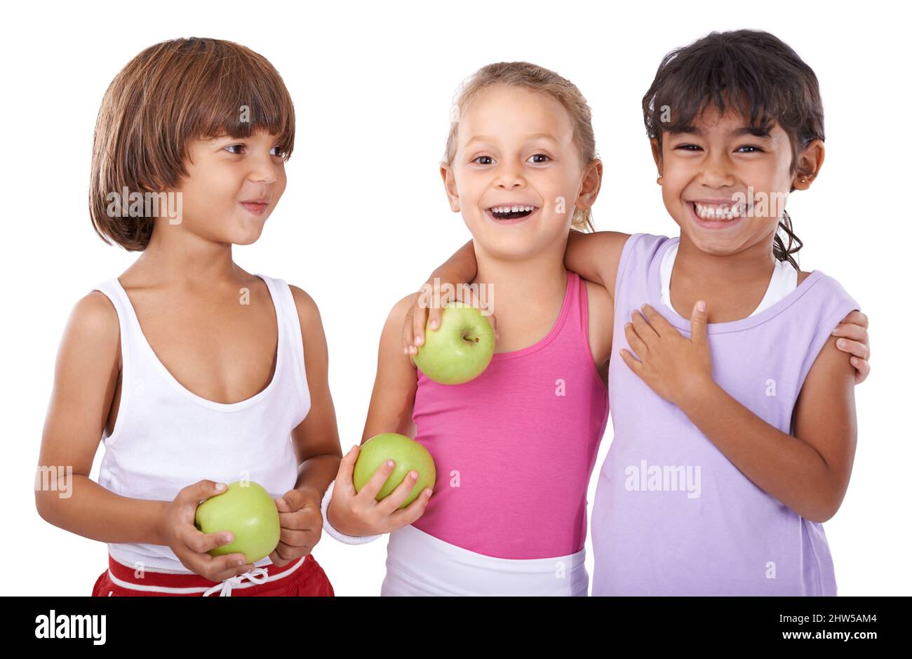 They will grow up healthy. Three young friends holding apples against a ...