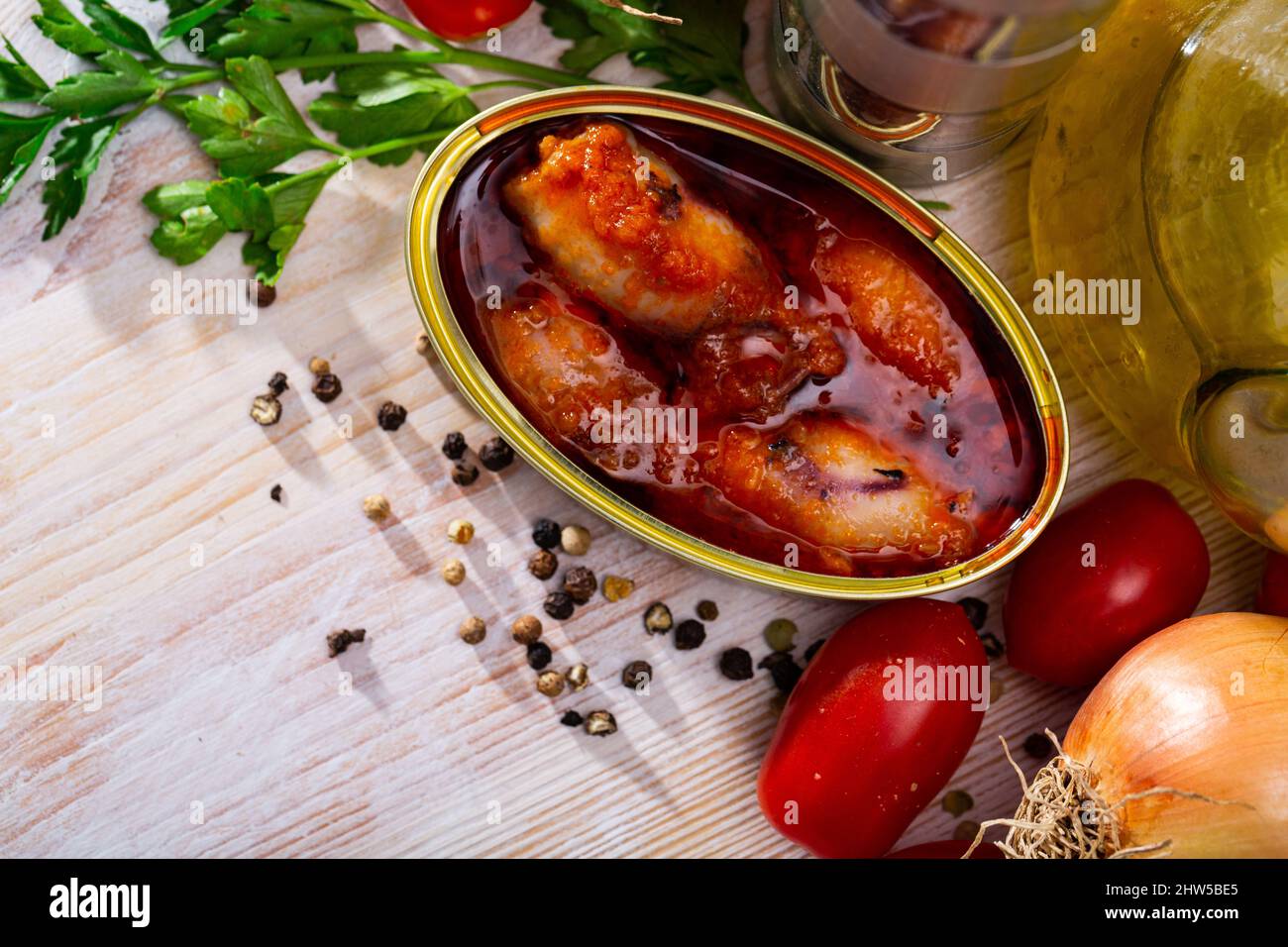 Opened can of stuffed squids Stock Photo - Alamy