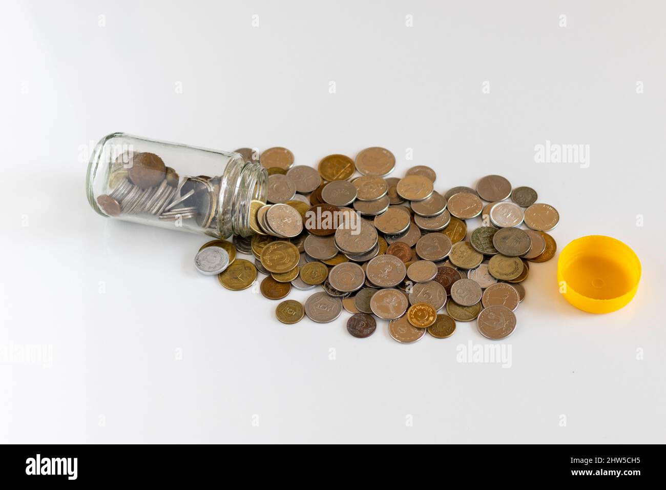 Coins saving concept for different purpose and goals Stock Photo - Alamy