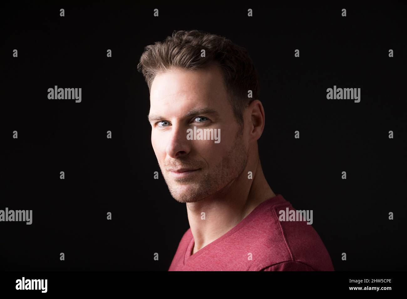 Studio portrait of serious man Stock Photo - Alamy