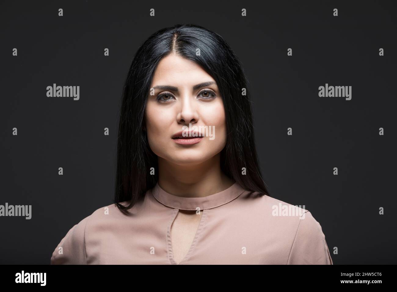 Studio portrait of serious woman Stock Photo - Alamy
