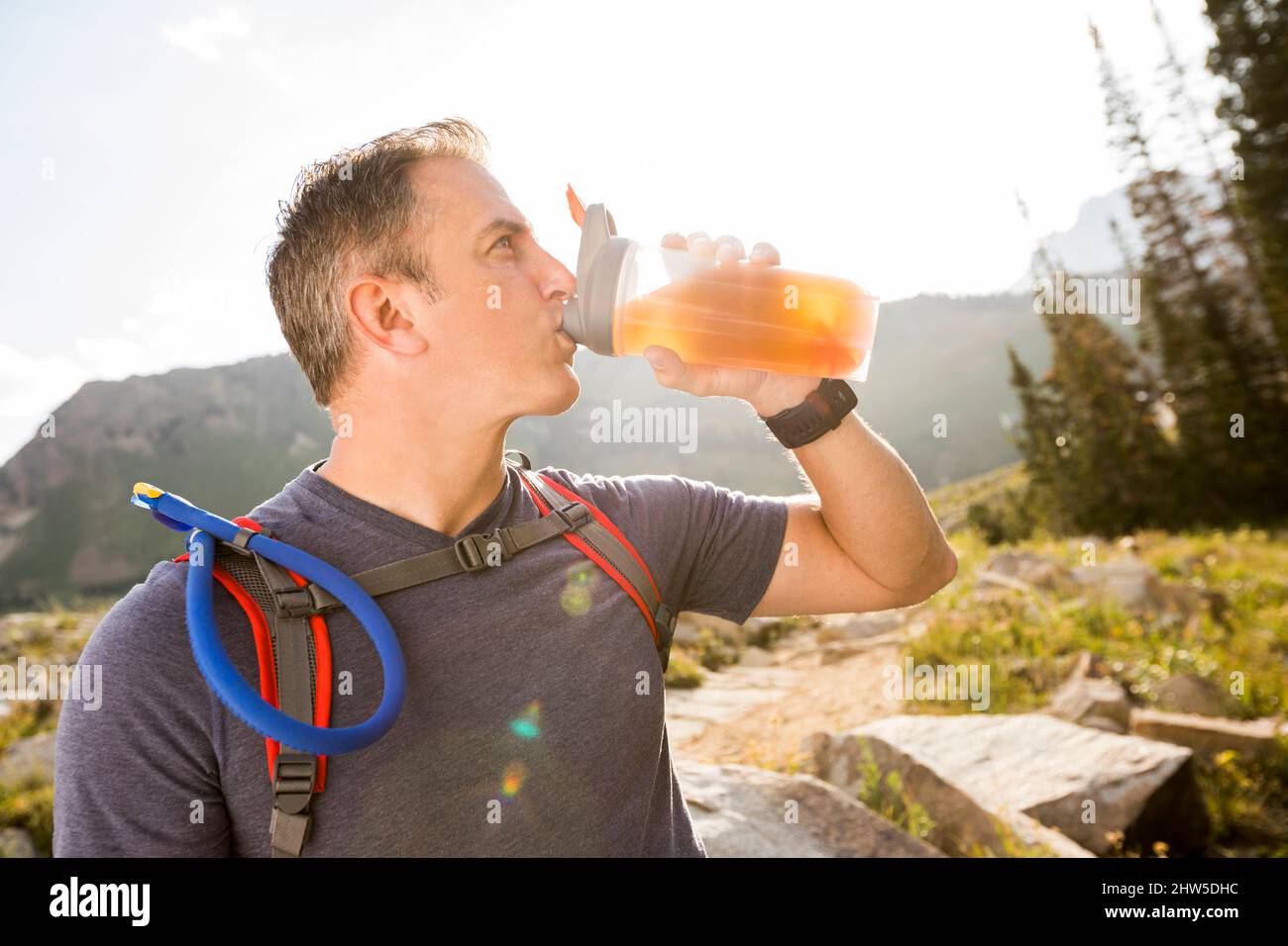 United States, Utah, Alpine, Male hiker drinking from bottle Stock ...