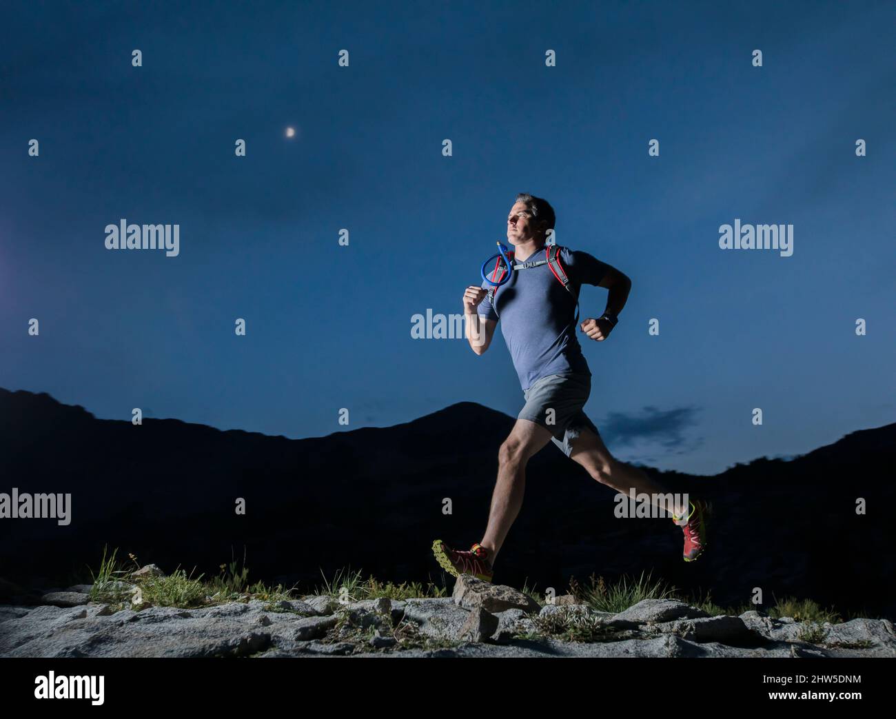 United States, Utah, Alpine, Man jogging in mountains at night Stock ...