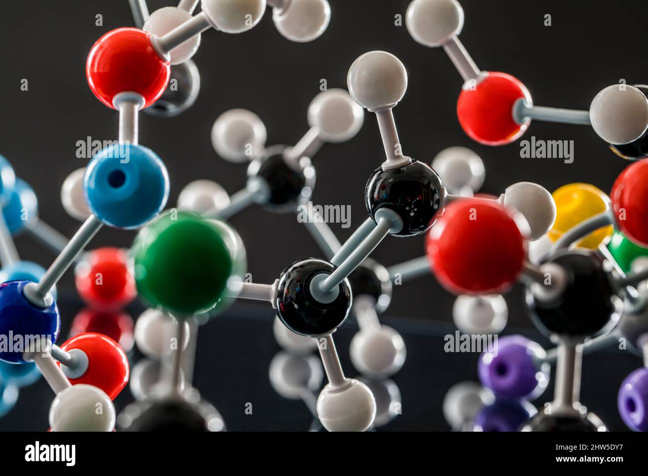 Molecular model against black background Stock Photo - Alamy
