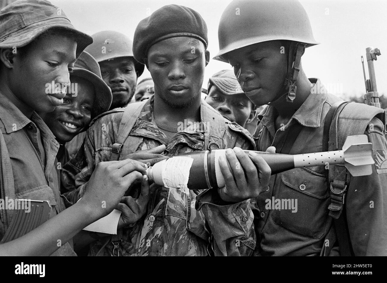 Biafran soldiers seen here inspecting a bomb during the Biafran conflict, 11th June 1968. The ...